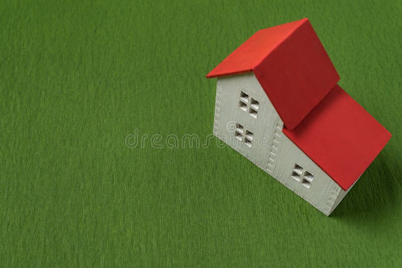 Top View on Model of House on Green Background. Eco-friendly House ...