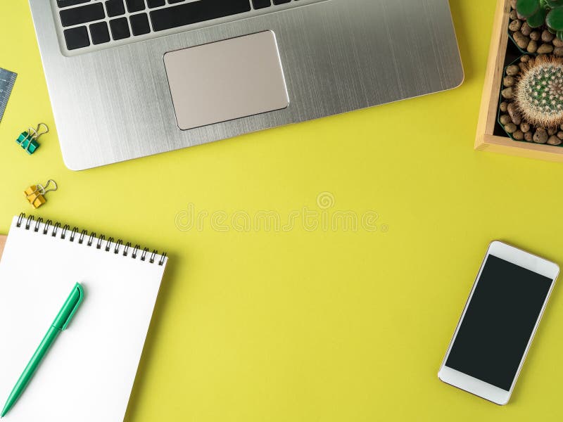 Top View of Modern Bright Yellow Office Desktop with Blank Notepad ...