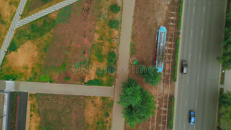 Top View of Modern Tram in City with Park. Clip. Tram in Motion on ... Top View of Modern Tram in City with Park. Clip. Tram in Motion on ...