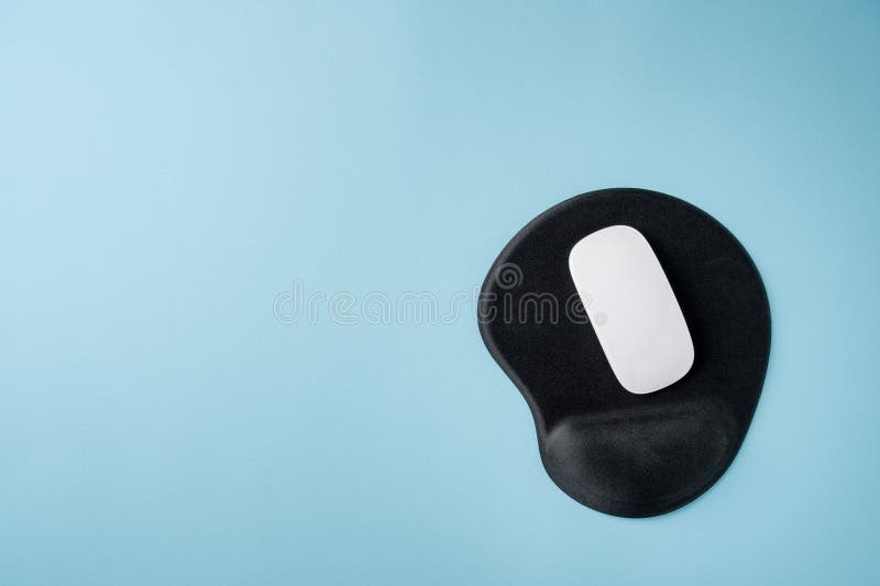 Top View of Modern White Mouse on Black Mousepad on Blue Table Stock ...
