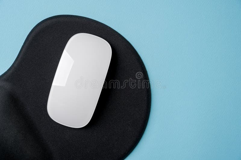 Top View of Modern White Mouse on Black Mousepad on Blue Table Stock ...