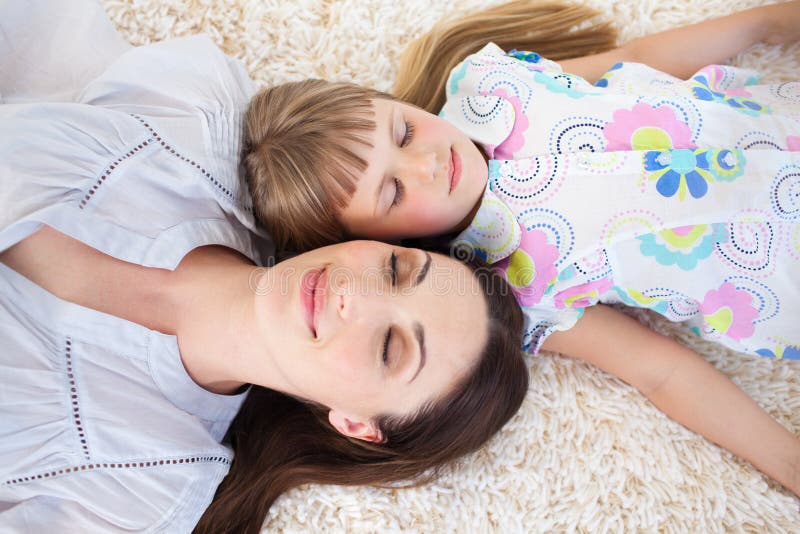 Top View of Mother and Daughter Lying on the Floor Stock Image - Image ...