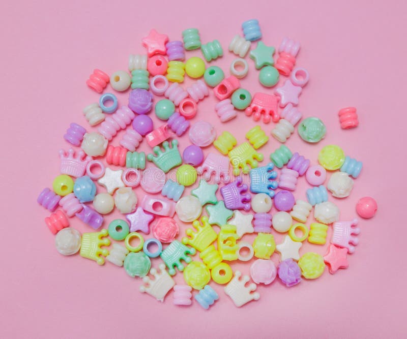 Top View of Multi-colored Beads on Pink Background Stock Image - Image ...