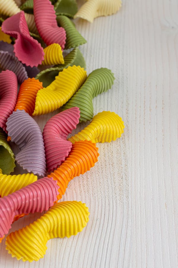 Top View of Multi-colored Pasta on White Wooden Background in ...