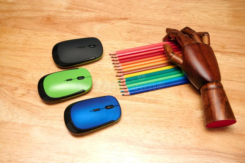 Top View of Multi-colored Pencils, Computer Mouses with an Articulated ...