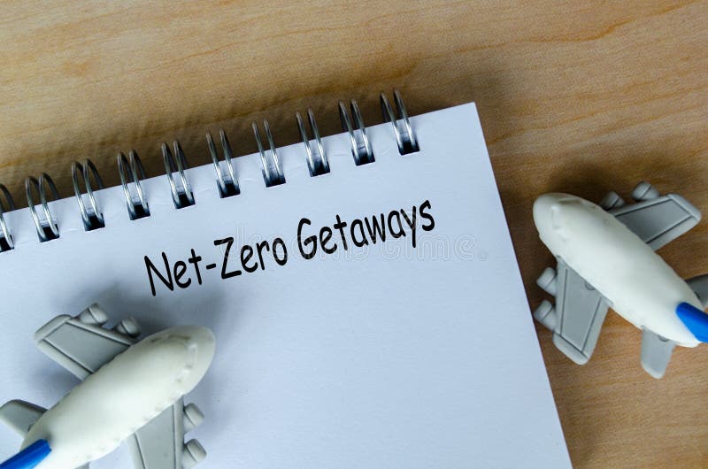 Top View of Net Zero Getaways Text on White Notepad with Small ...