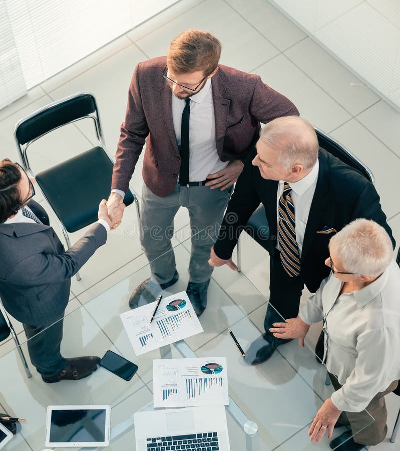 Top View. New Financial Partners Shaking Hands Stock Image - Image of ...