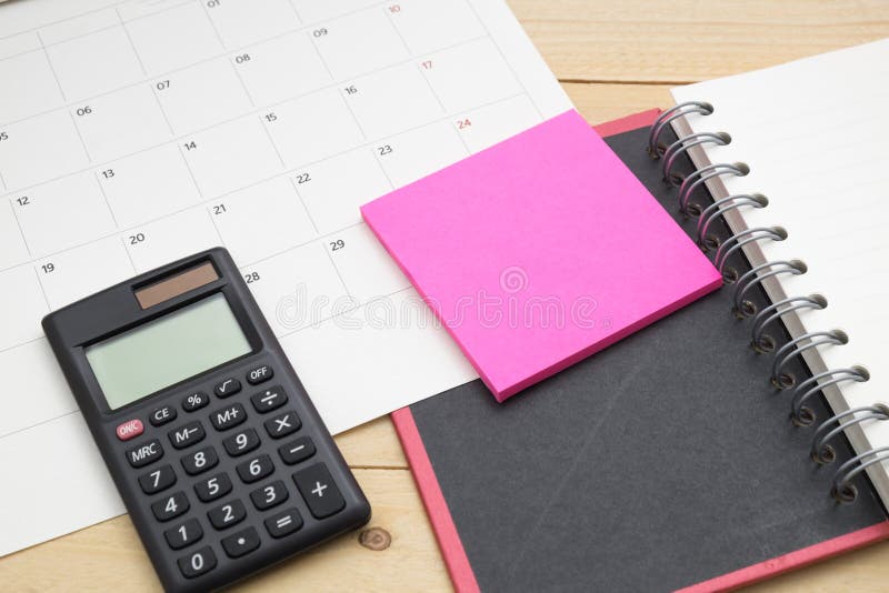 Top View Notebook ,calculator,post it Note and Calendar Put on W Stock ...