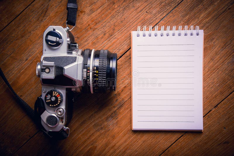 Top View of Notebook Paper and Camera on Office Desk Table. Stock Photo ...