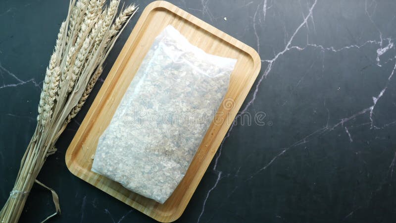Top View of Oats Flakes in a Plastic Packet on Table Stock Video ...