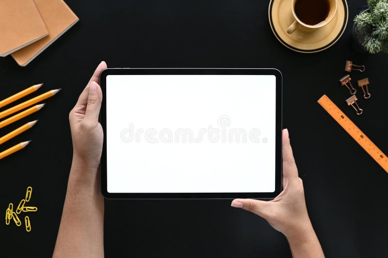 Top View Office Desk with Hands Holding Tablet while Working in Dark ...