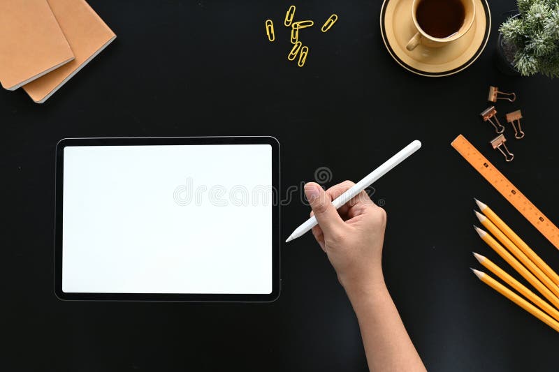 Top View Office Desk with Hands Holding Tablet while Working in Dark ...