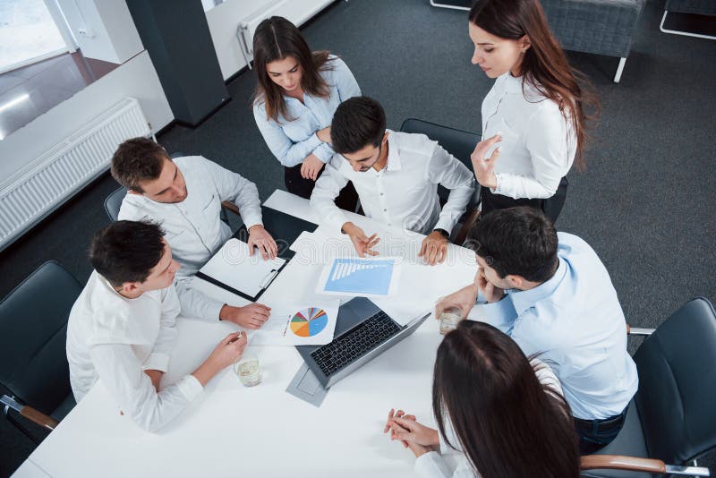 Top View of Office Workers in Classic Wear Sitting Near the Table Using ...