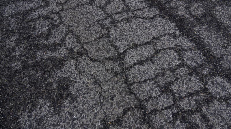 Top View of an Old Asphalt Road in Wet Cracks. Worn Road with Cracks ...