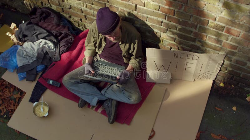 Top View of Old Homeless Man Holding Laptop in Hands. Stock Video ...