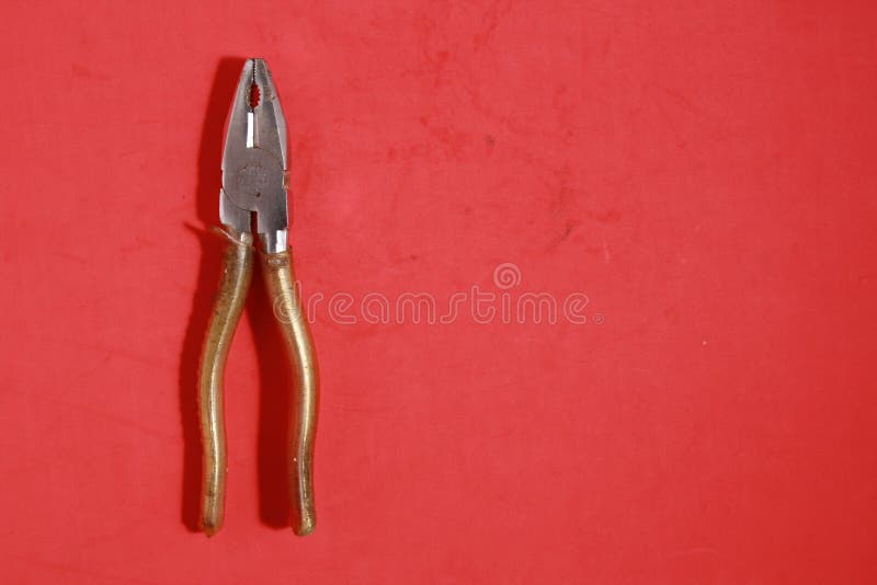 Top View of Old Pliers Isolated N a Red Background Stock Photo - Image ...