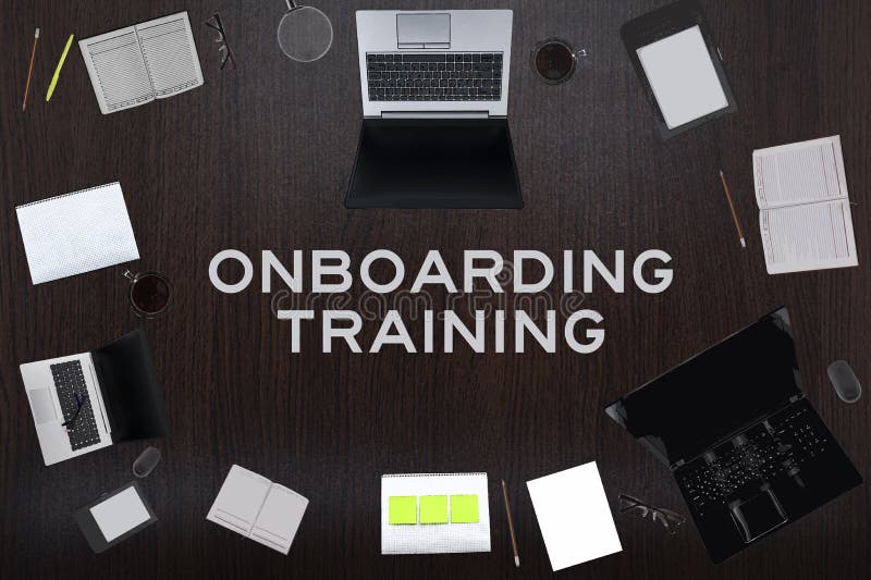 Top View of Onboarding Training Text on the Table with Laptops, Notepad ...
