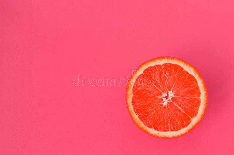 Top View of a One Grapefruit Slice on Bright Background in Light Pink ...