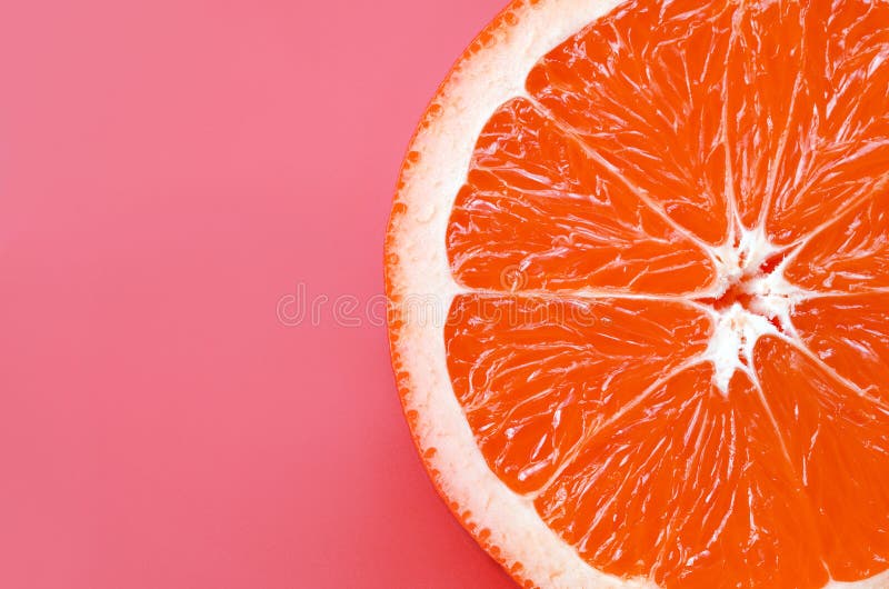 Top View of a One Grapefruit Slice on Bright Background in Light Pink ...