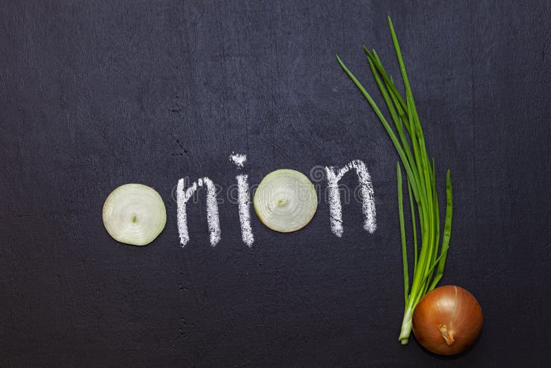 Top View, an Onion and a Bunch of Green Onions on a Chalkboard. Text in ...