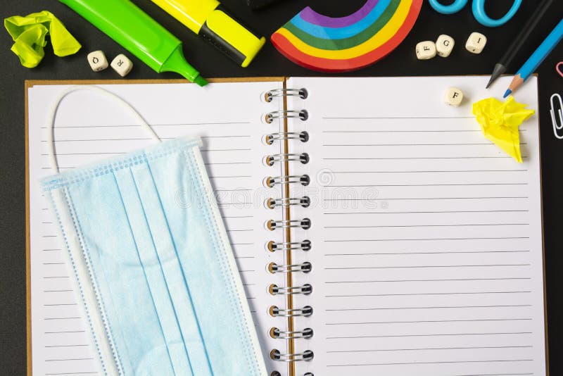 Top View of Open Notebook with Face Mask, Colorful Pencils, Rainbow ...