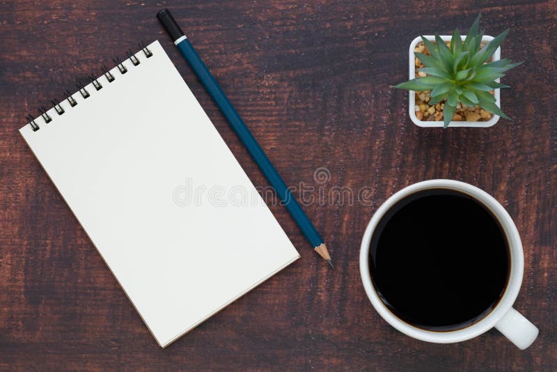 Top View of Open School Notebook with Blank Pages, Coffee Cup and ... Top View of Open School Notebook with Blank Pages, Coffee Cup and ...
