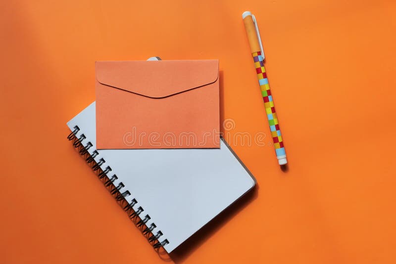 Top View of Orange Color Envelope, Notepad and Pen Stock Photo - Image ...
