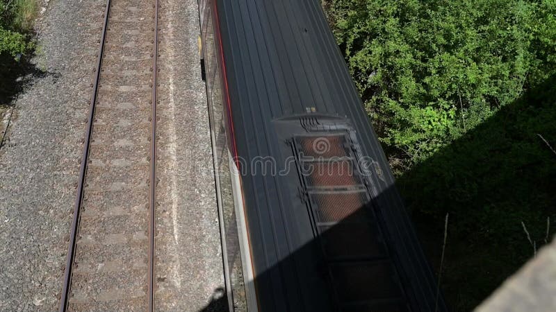 Top View of Passenger Train Passing Under a Bridge Stock Video - Video ...