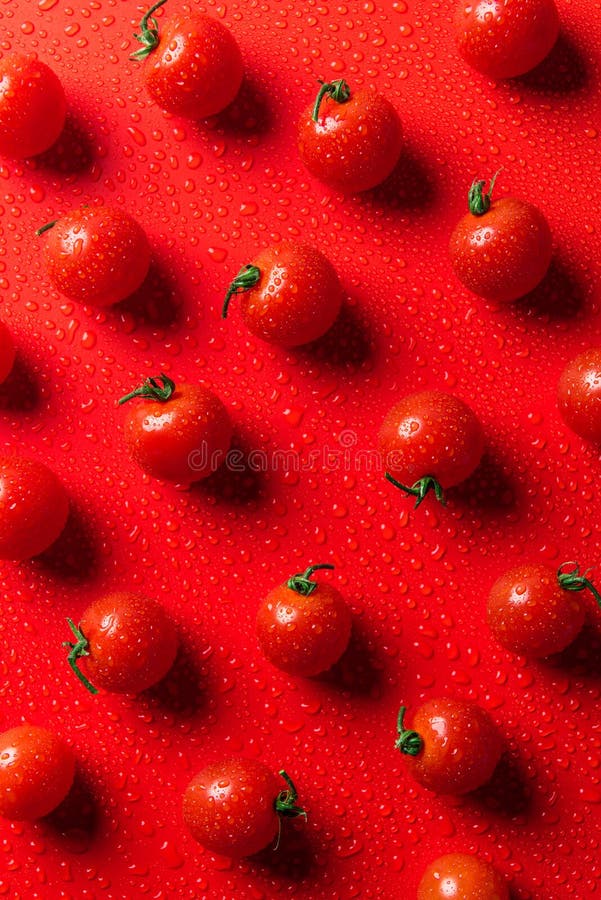 Top View of Pattern of Cherry Tomatoes on Red Surface Stock Image ...