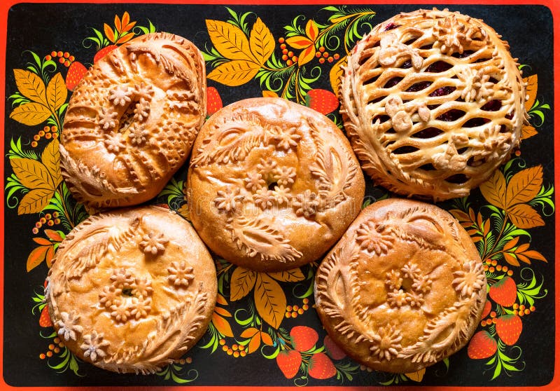 Top View of Patterned Closed Russian Pies on Table Stock Photo - Image ...