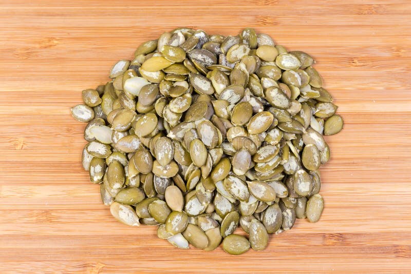 Top View of Peeled Pumpkin Seeds Heap on Wooden Surface Stock Photo ...