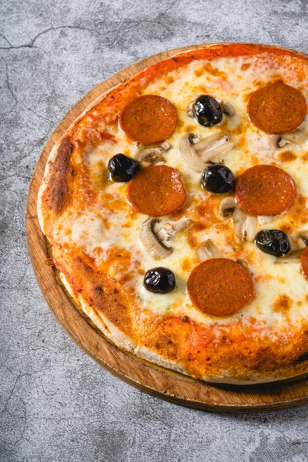 Top View of Pepperoni, Mushroom and Olive Neapolitan Pizza Stock Photo ...
