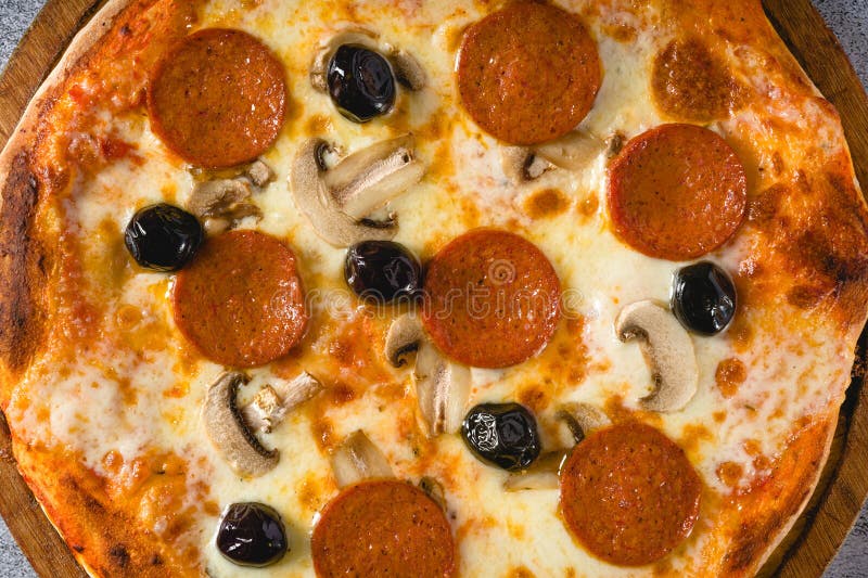 Top View of Pepperoni, Mushroom and Olive Neapolitan Pizza Stock Photo ...