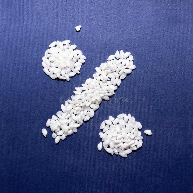 Top View of Percent Sign Made of Rice Grains on the Blue Background ...