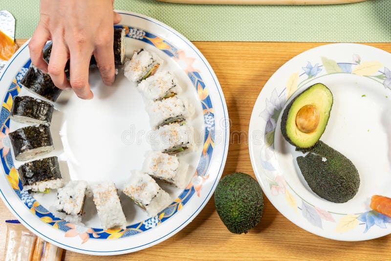 Top View of a Person Organizing Sushi Rolls on a Plate Stock Image ...