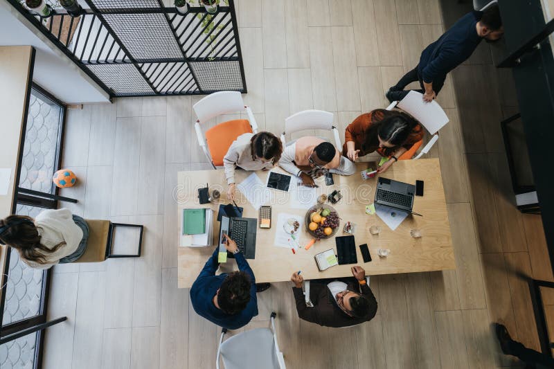 Top View Photo of Colleagues in Creative Office Discussing Product ...