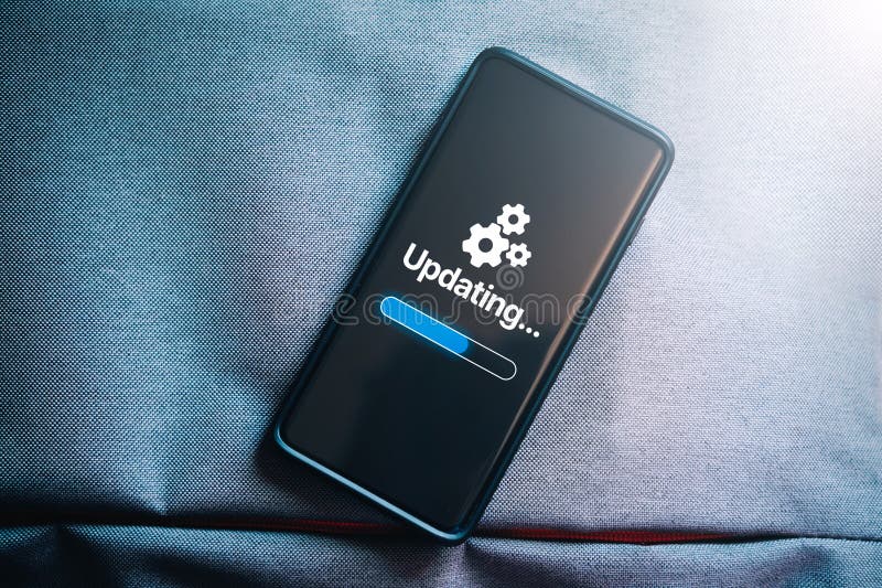 Top View Photo of Smartphone with Updating Software on Screen. Stock ...