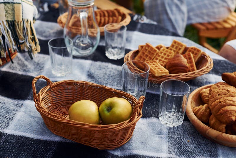 Top View of Picnic Table with Apples, Sweets and Empty Glasses on it ...