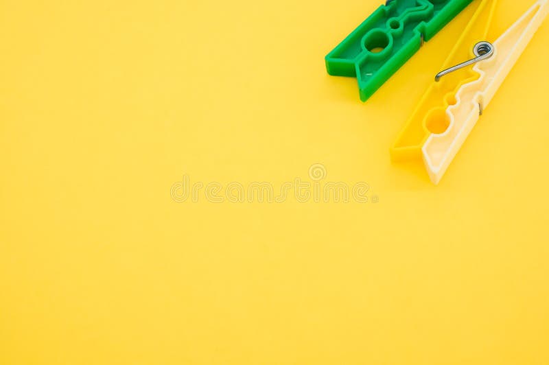Top View of Plastic Clothespins Isolated on Yellow Background Stock ...