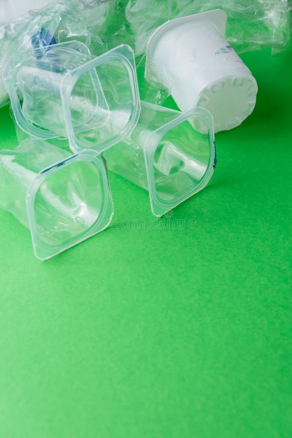 Top View of Plastic Containers on Green Background, Ready for Recycling ...