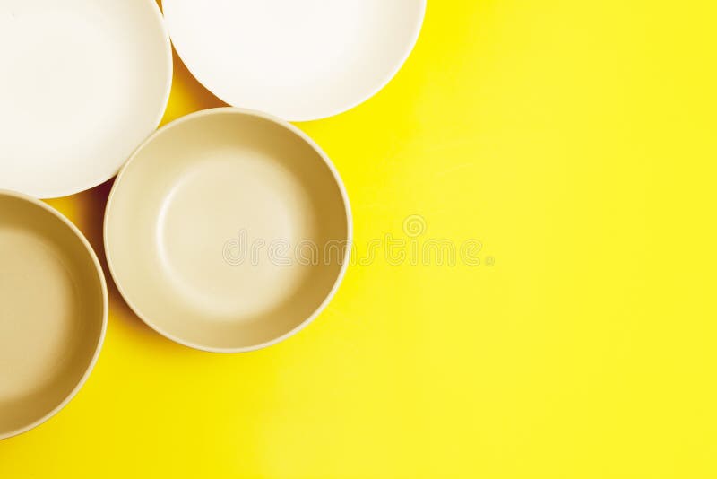 Top View Plates on Yellow Background with Copy Space. Stock Image ...