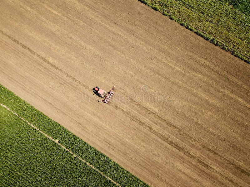 Top View of Red Tractor Plows a Field Stock Photo - Image of farming ...