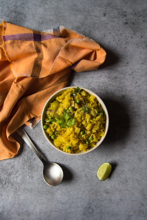A Bowl of Poha Along with a Glass of Tea, a Typical Indian Breakfast ...