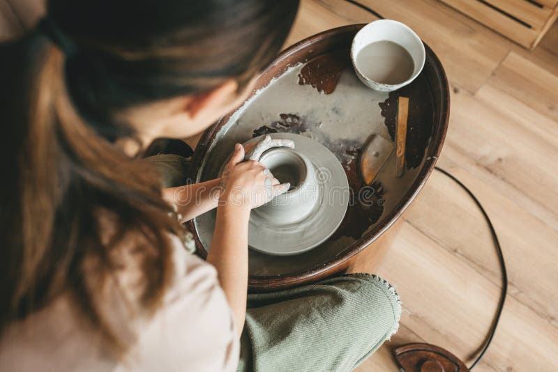 Top View of Pottery Maker Works in Clay Studio on Pottery Wheel. Stock ...