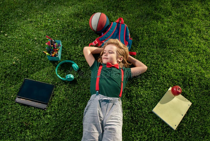 Top View of Preschool Student Kid Lying on the Grass and Taking a Class ...