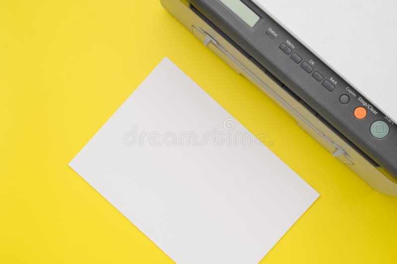 Top View of the Printer and a Blank Sheet of A4 Paper on a Yellow ...