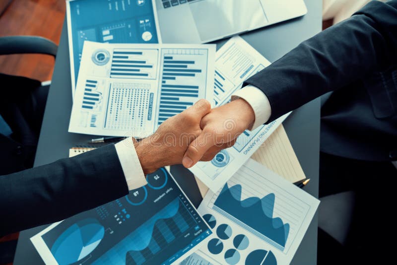 Top View Businessman Handshake Over Desk with BI Papers. Fervent Stock ...