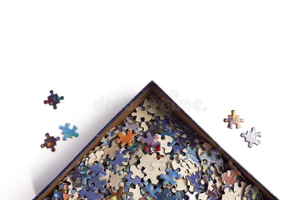 Top View of Puzzle Pieces in a Box on a White Surface with Space for ...