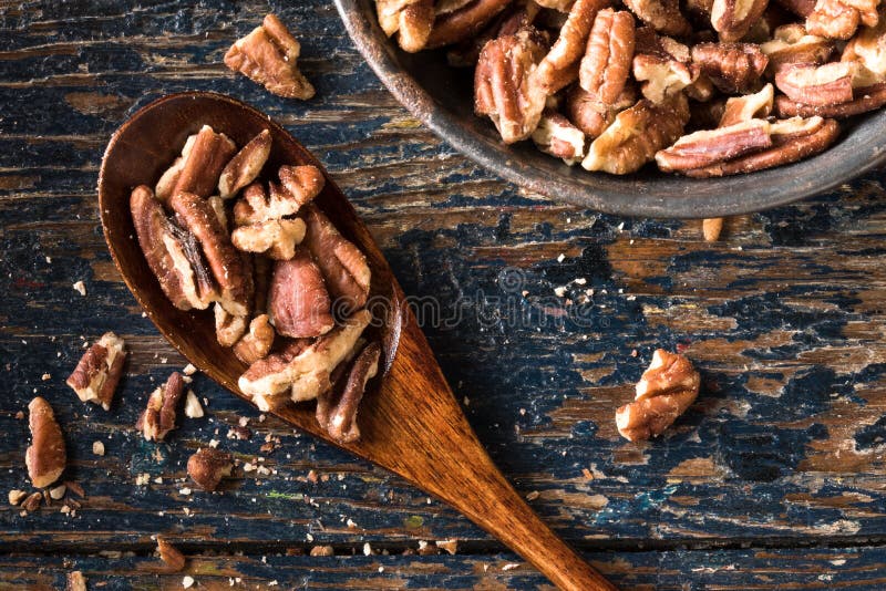 Raw Pecans on a Wood Spoon stock photo. Image of macro - 152315462
