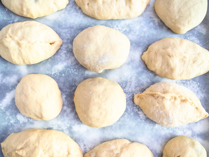 Raw Handmade Sweet Buns on Baking Paper Stock Photo - Image of bakery ...